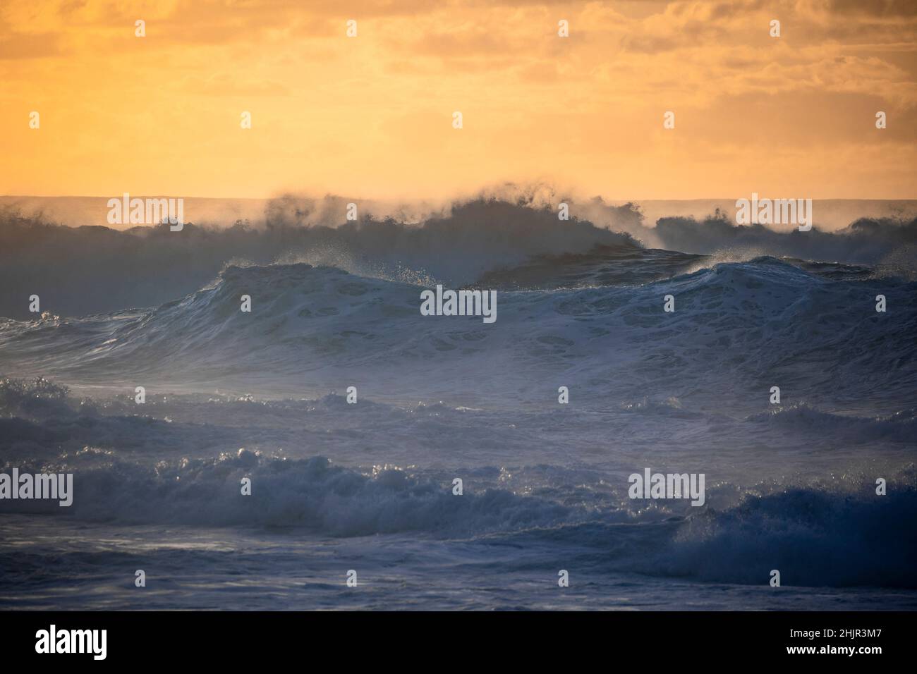 Misty Sunset over Waves on North Shore of Oahu Stock Photo - Alamy