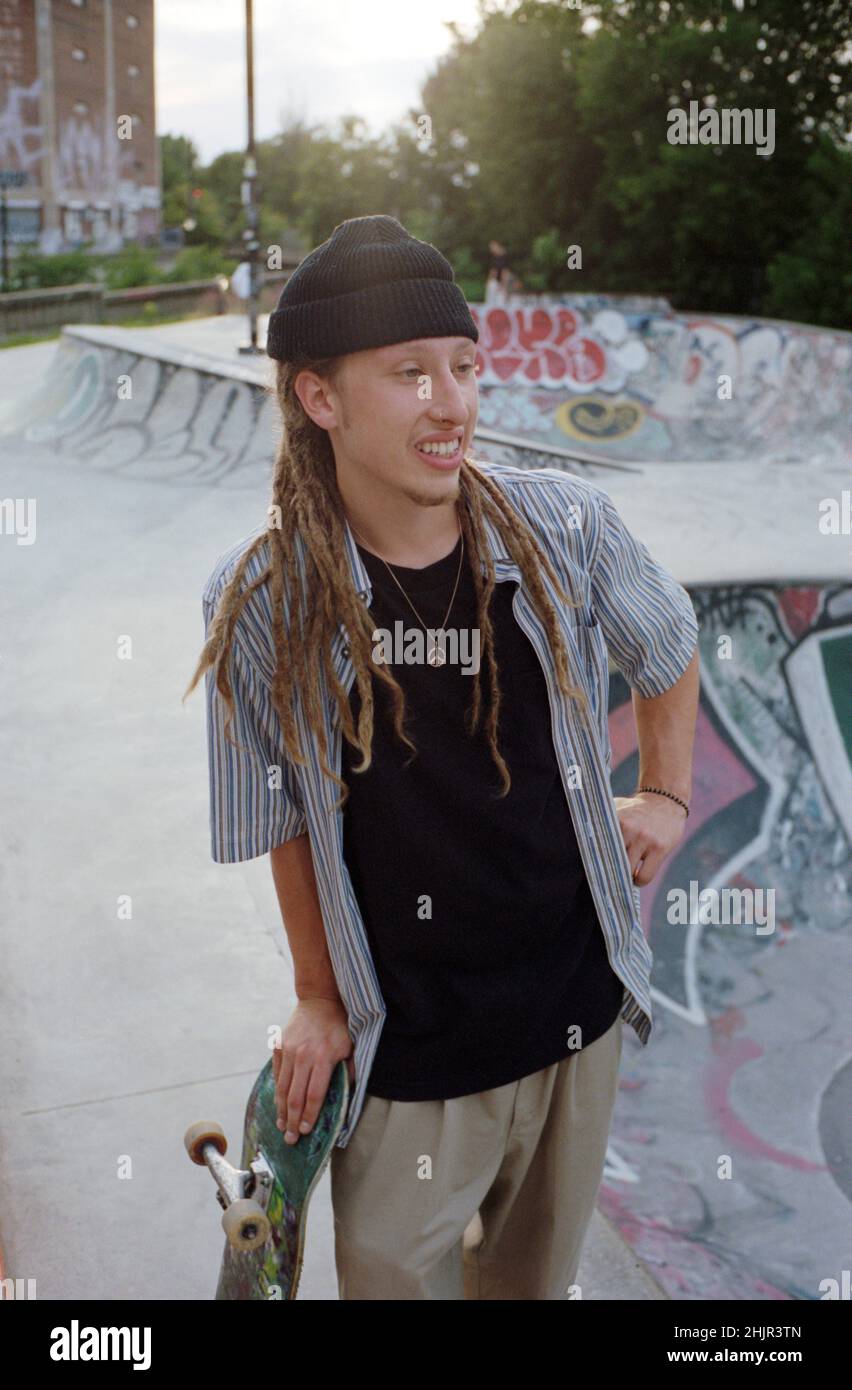 Teenage skateboard athlete with dreadlocks Stock Photo - Alamy