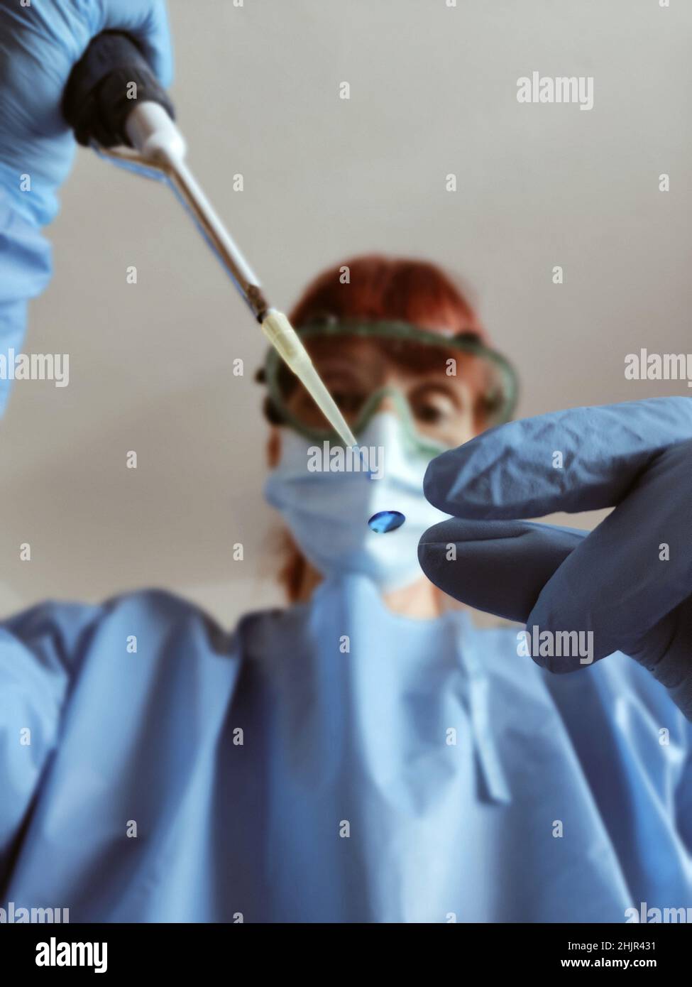 Laboratory technician pipetting liquid chemicals Stock Photo - Alamy