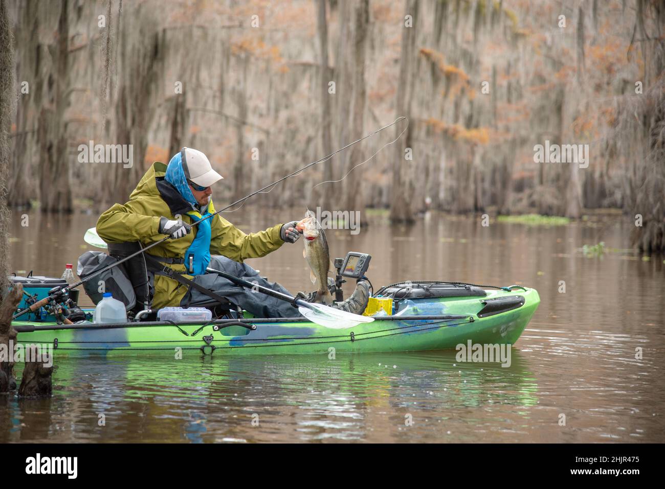 man catching largemouth bass in yak Stock Photo - Alamy
