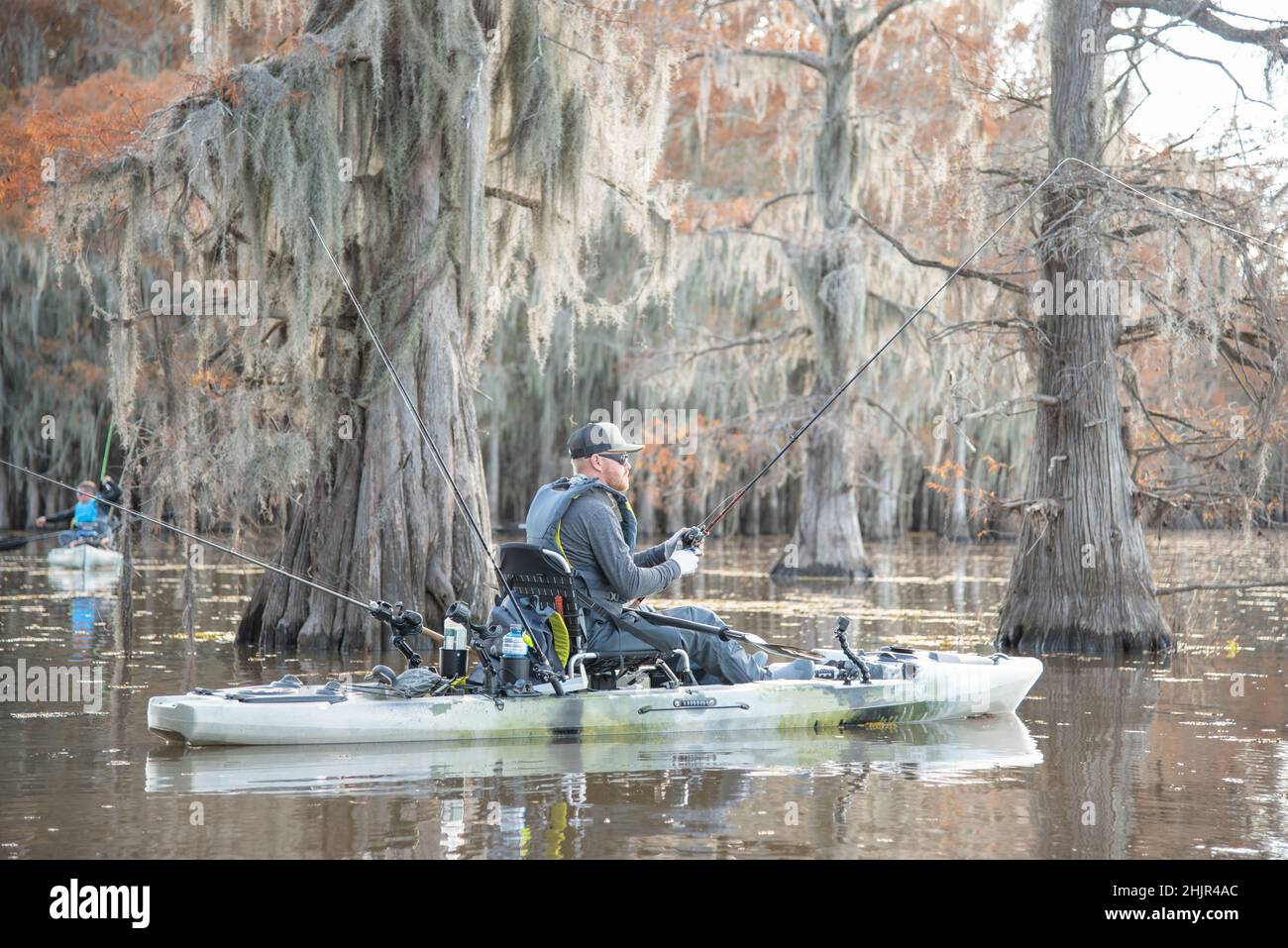 man kayak fishing in forest Stock Photo - Alamy