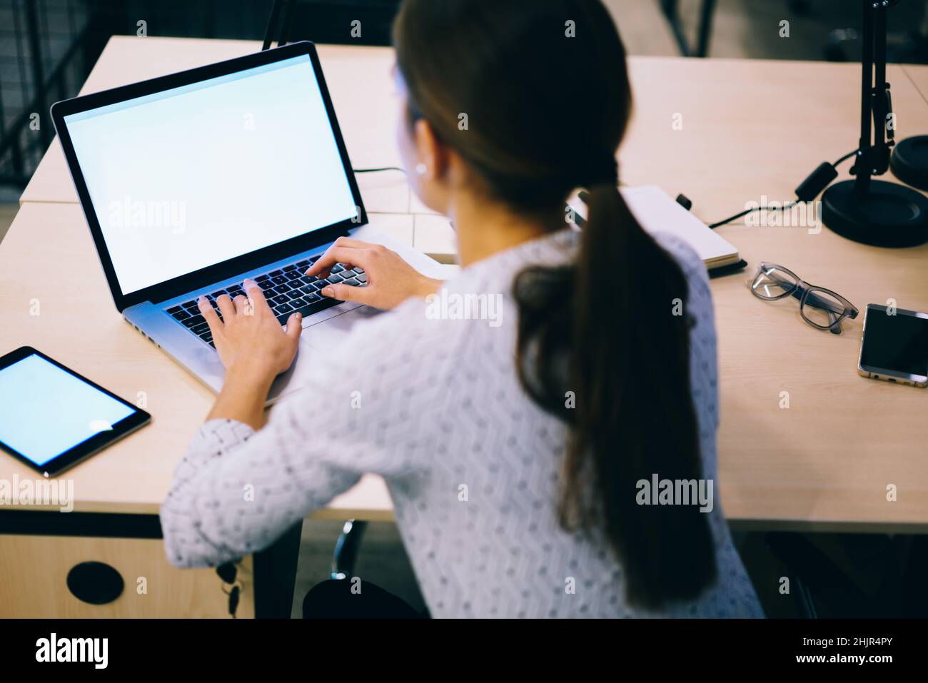 Woman typing computer back view hi-res stock photography and images - Alamy