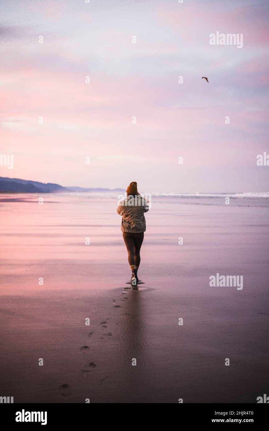Person on beach sunrise purple hi-res stock photography and images - Alamy