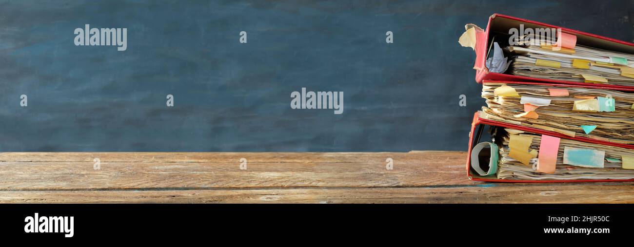 Heap of messy file folders,red tape, bureaucracy,aministration or ...