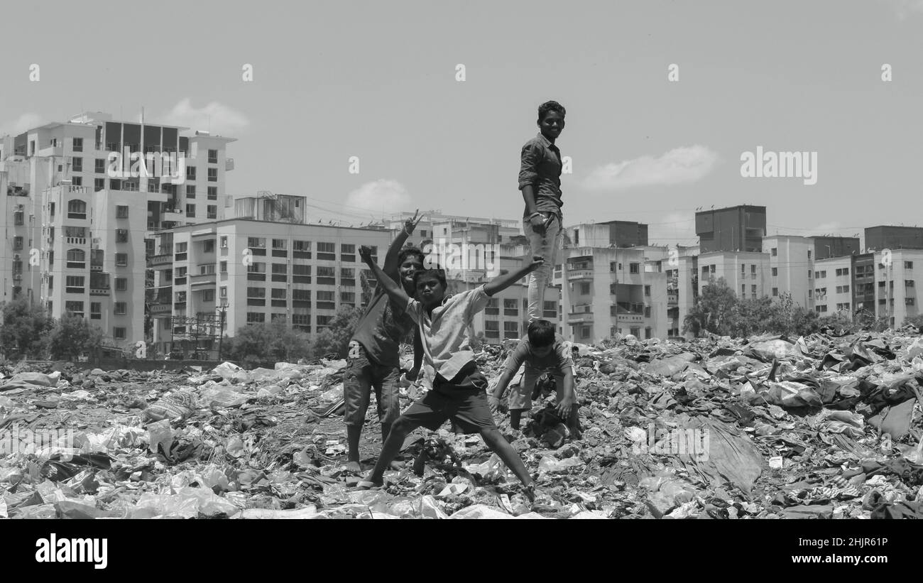 Group of kids in a poor neighborhood of India Stock Photo - Alamy