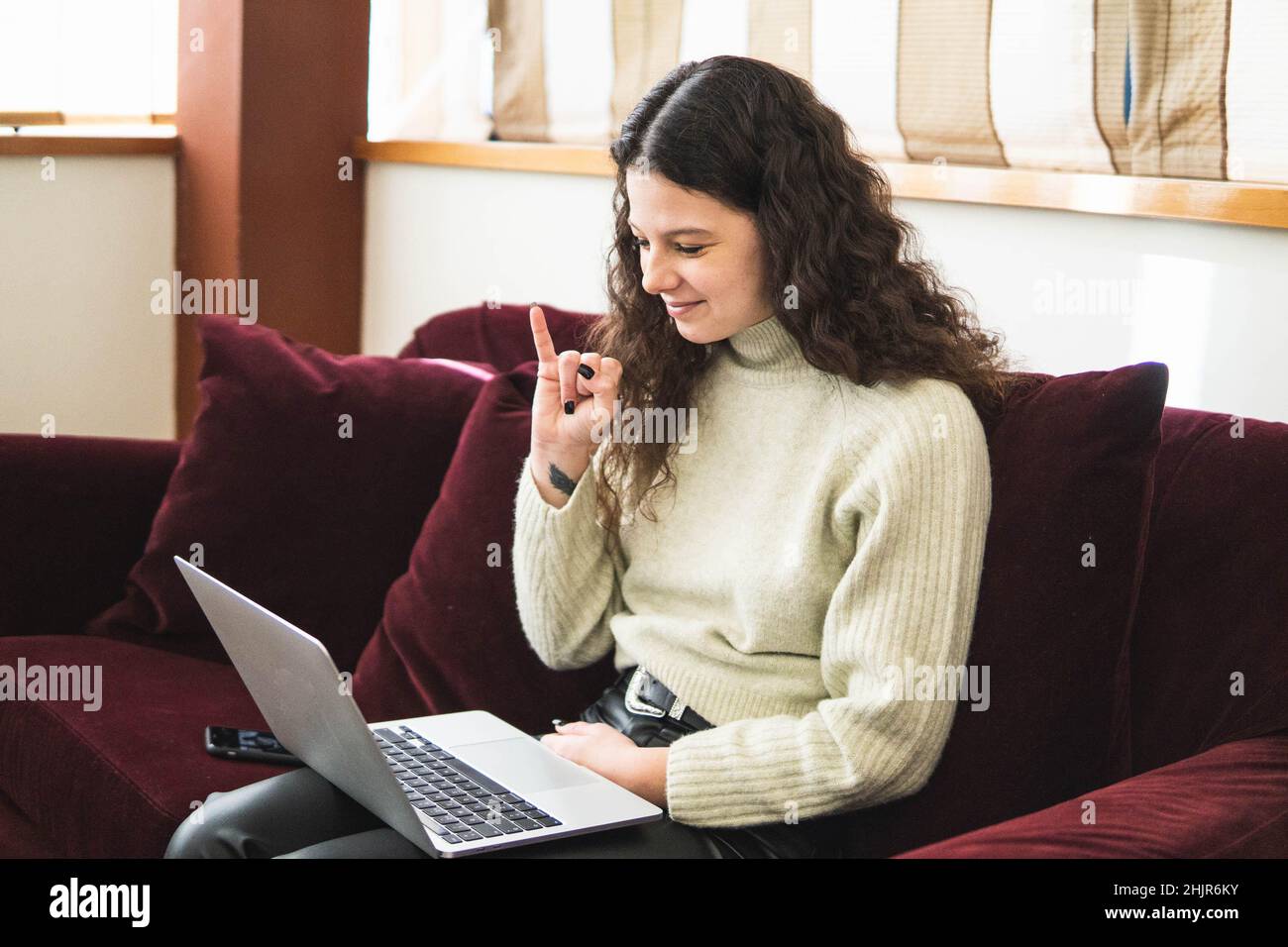 girl speaking sign language on video call Stock Photo - Alamy