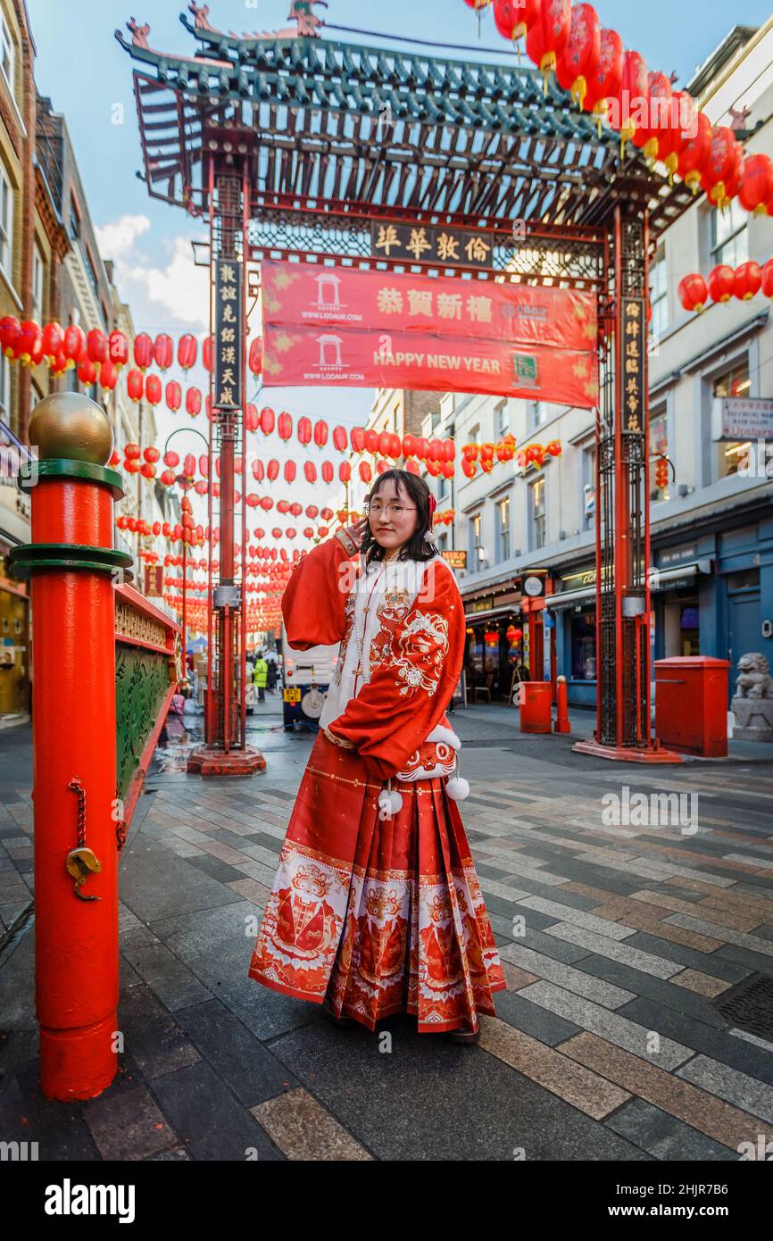 Portrait of a beautiful Chinese lady in a traditional outfit in ...