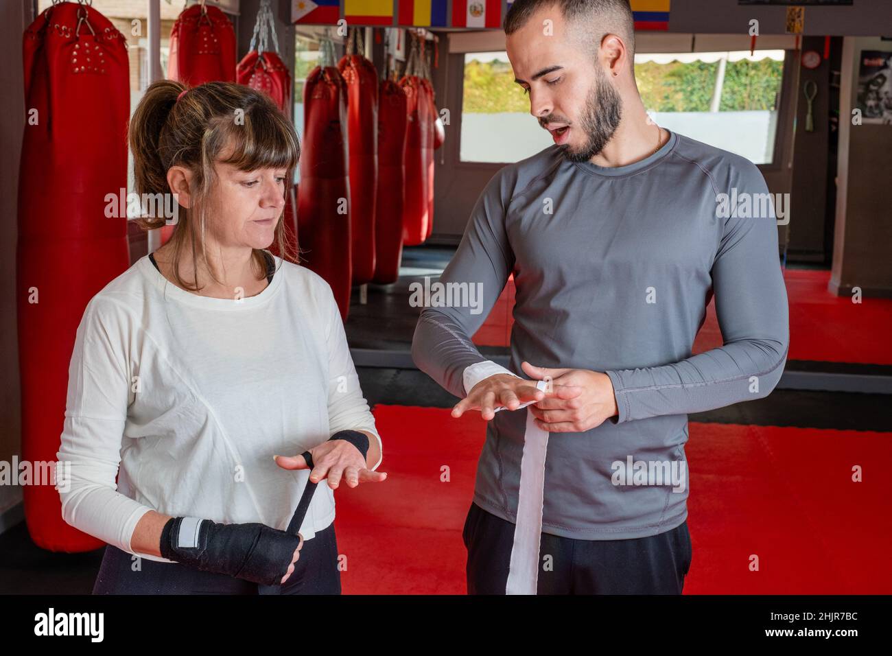 Mature student with teacher in boxing gymnasium Stock Photo - Alamy