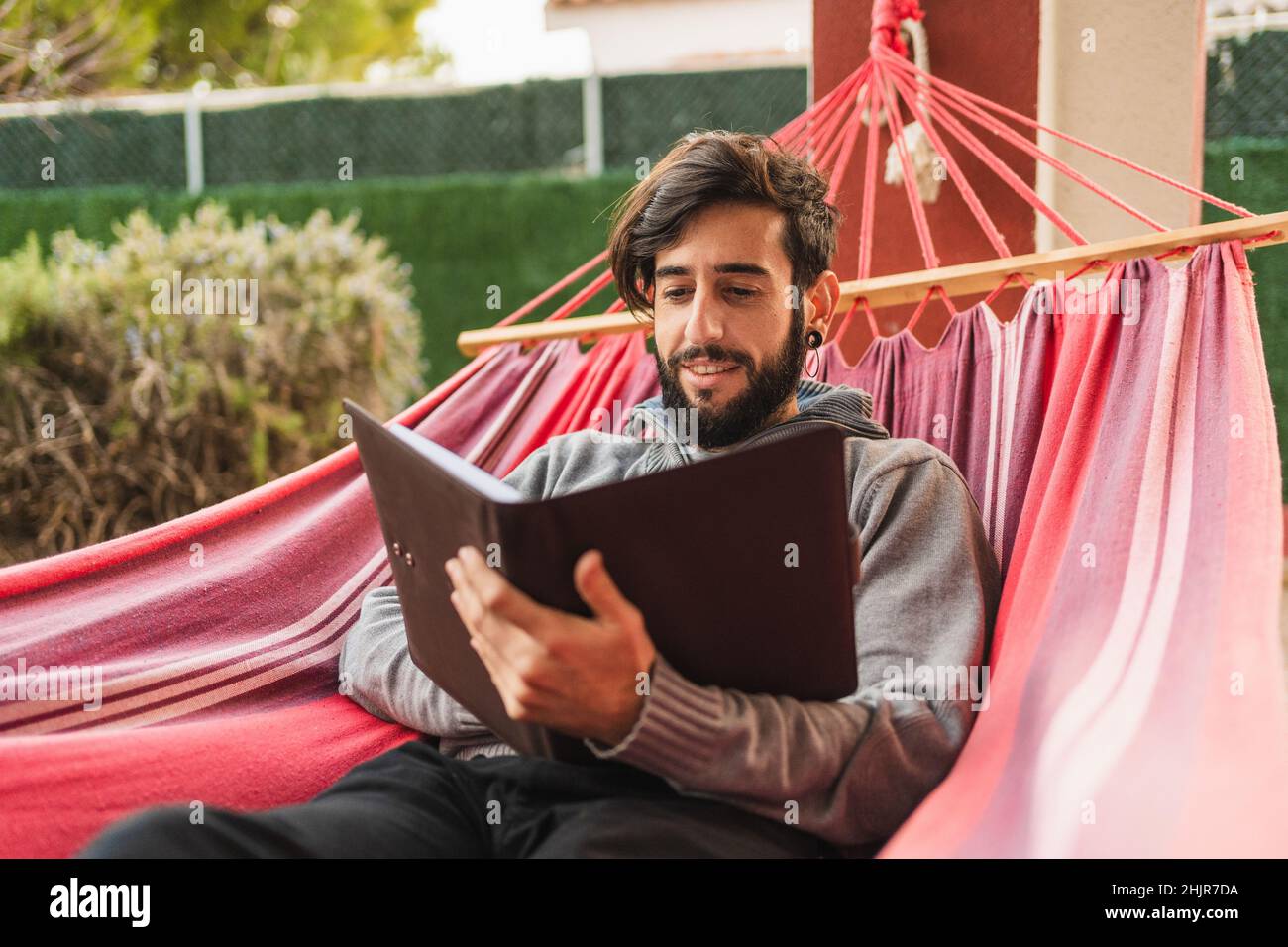 Man in hammock hi-res stock photography and images - Alamy