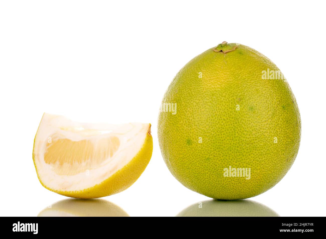 One slice and one whole sweet pomelo, macro, isolated on white Stock ...