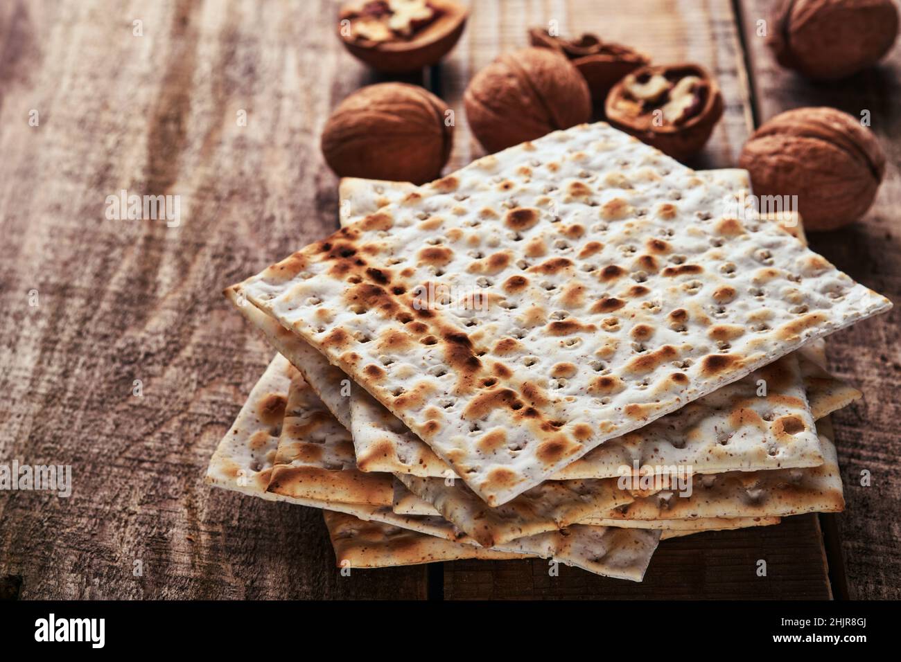 Matzah and walnut. Traditional ritual Jewish bread on old wooden rustic ...