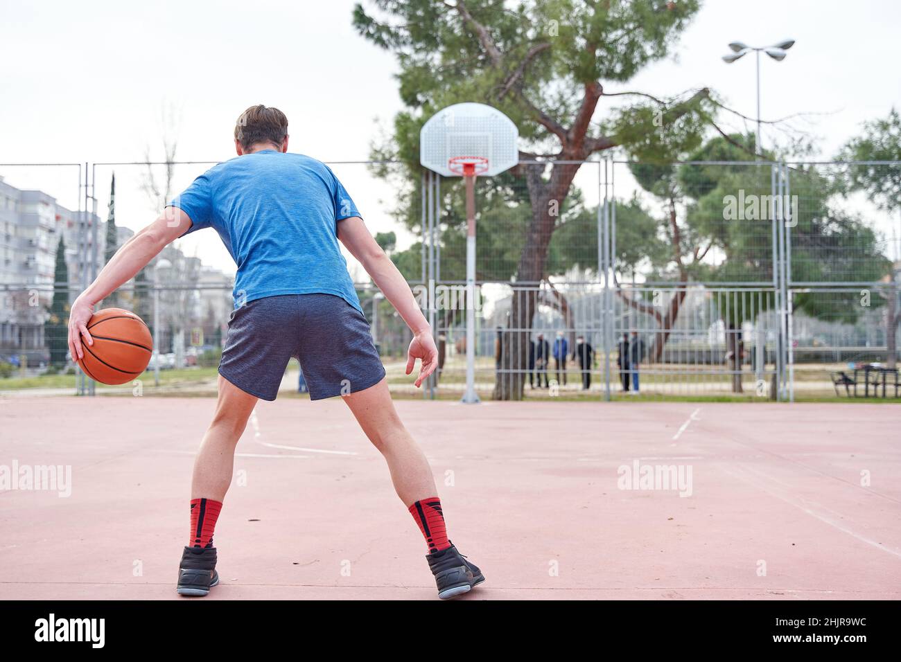 basketball player dribbling the ball before shooting the basket. young ...