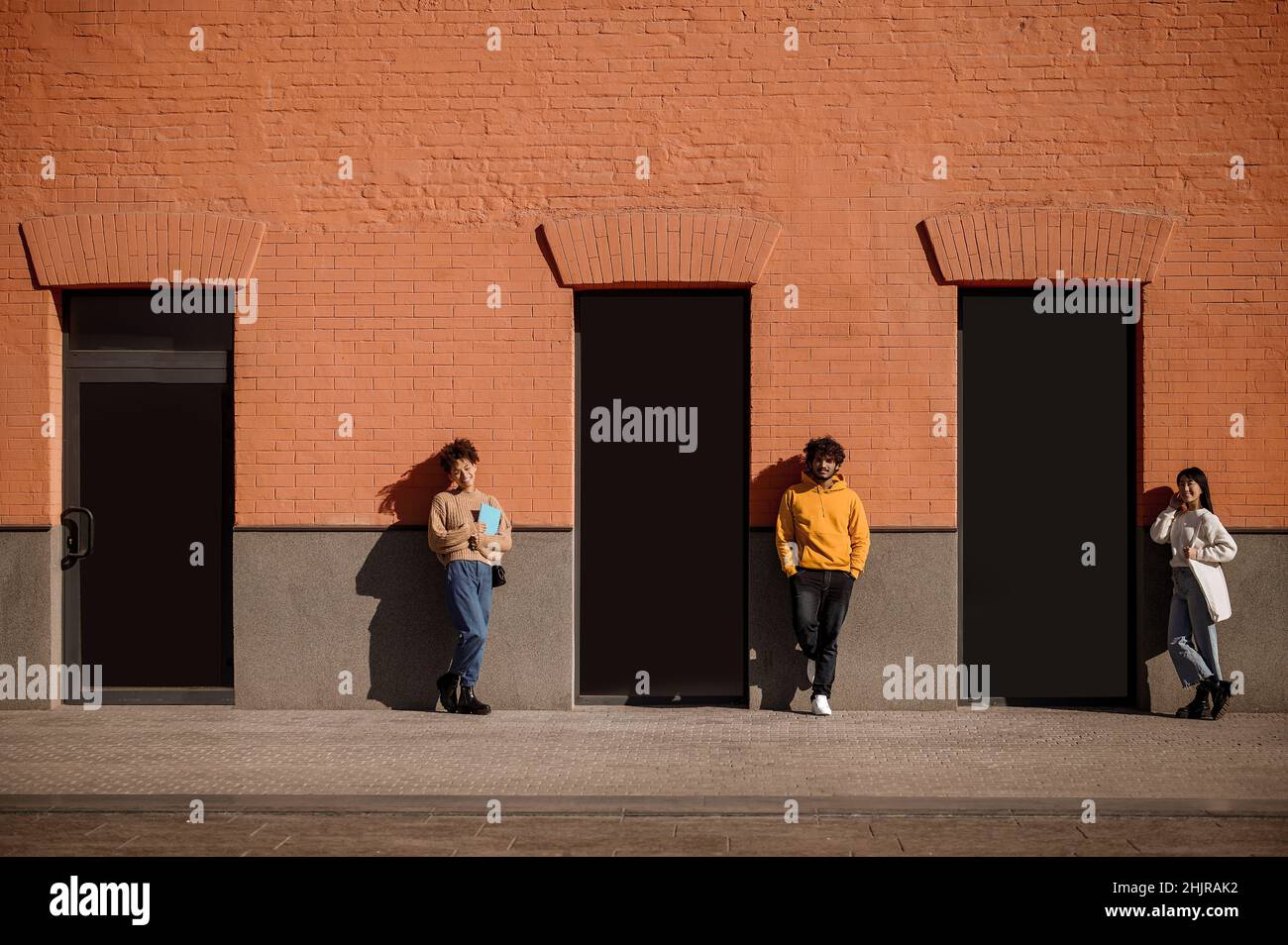 Cheerful guy standing hi-res stock photography and images - Alamy