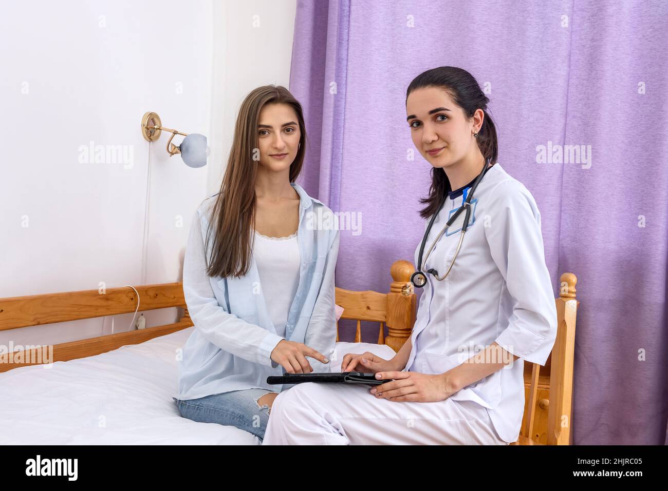 Medical concept. Doctor and patient in hospital posing for camera Stock ...