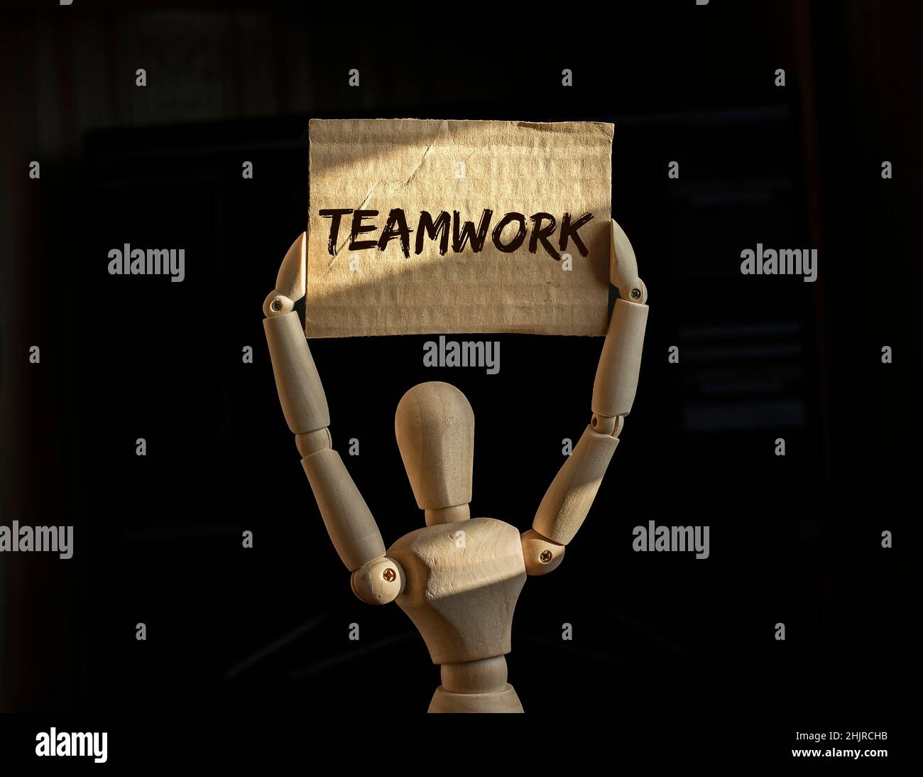Teamwork word. Announcement on paper in hands Stock Photo - Alamy