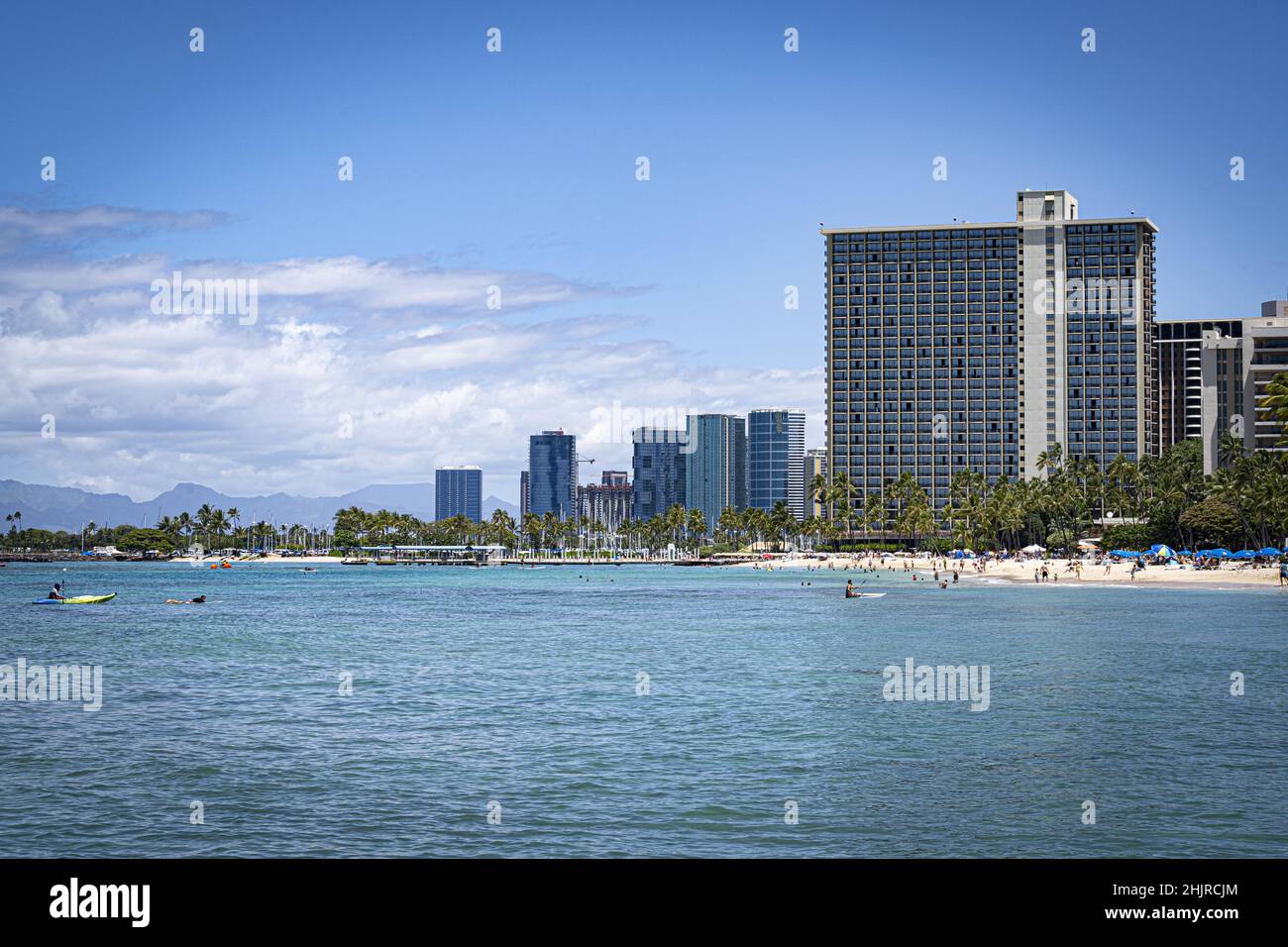 Urban sunny beach with people swimming, surfing, and relaxing Stock ...