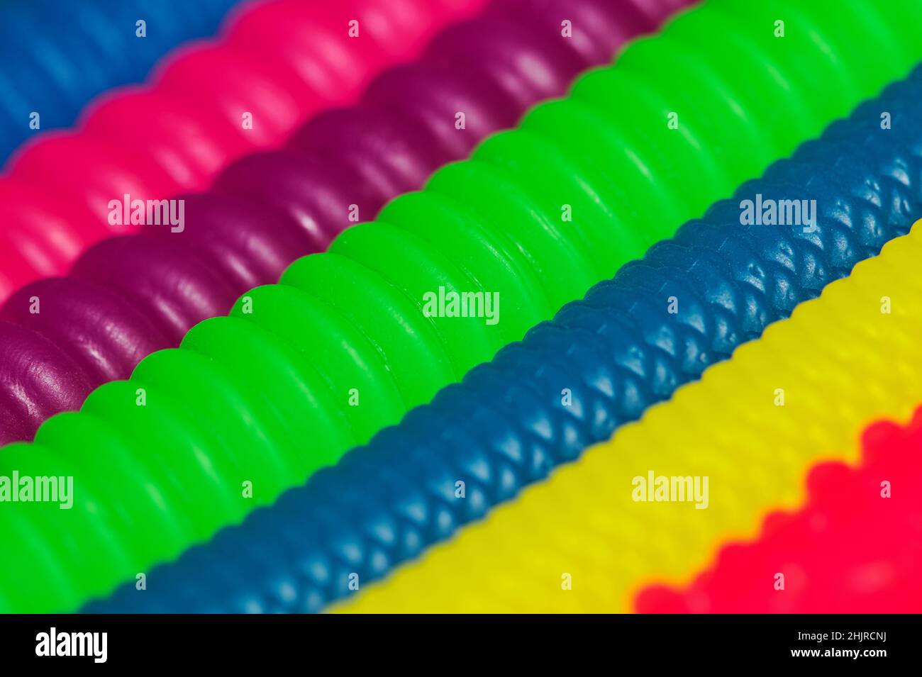Colorful vibrant rubber cylinder shapes with different abstract ...
