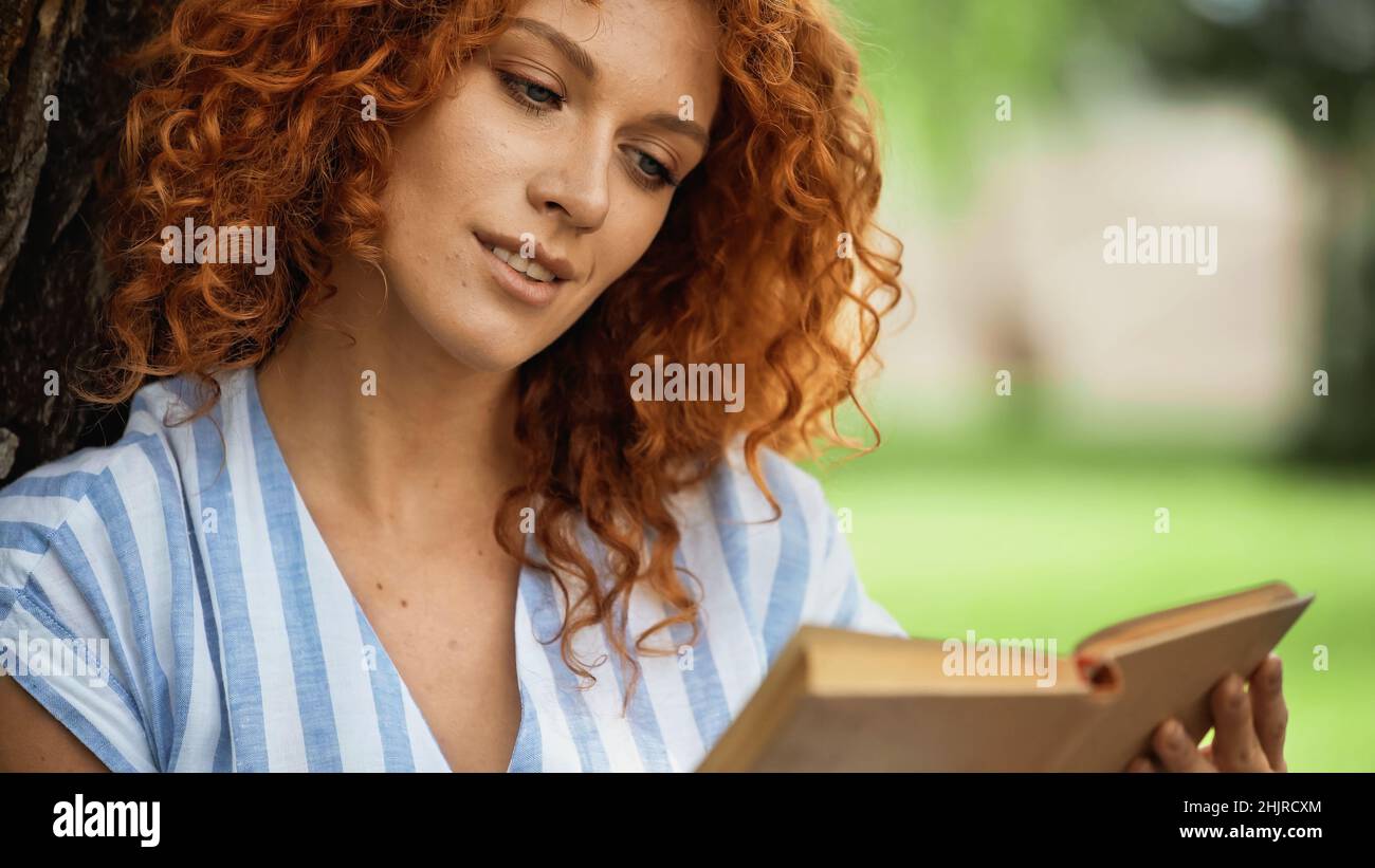 Curly redhead woman read hi-res stock photography and images - Alamy