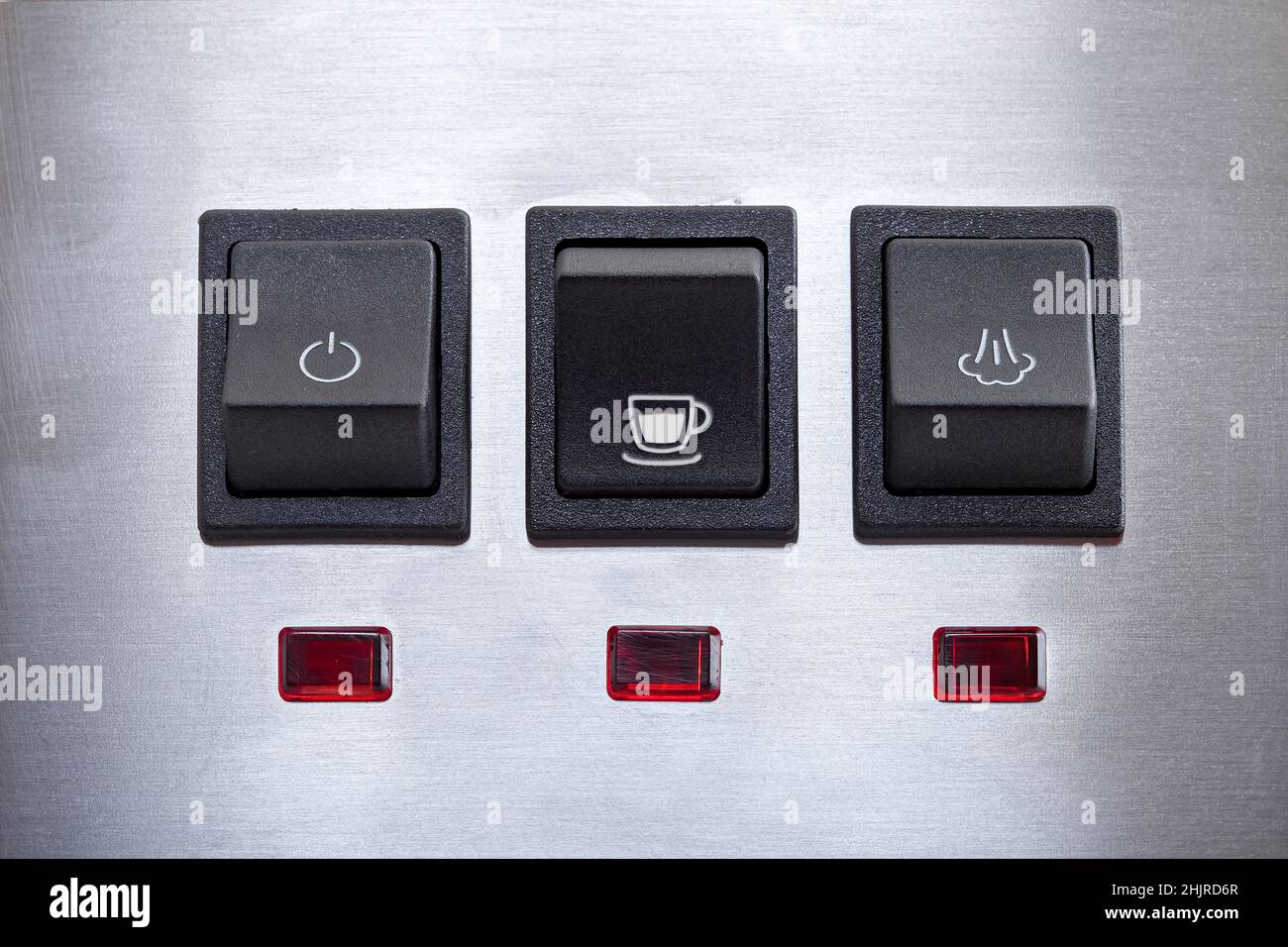 Black coffee brew button with drink cup symbol, close-up of panel with ...