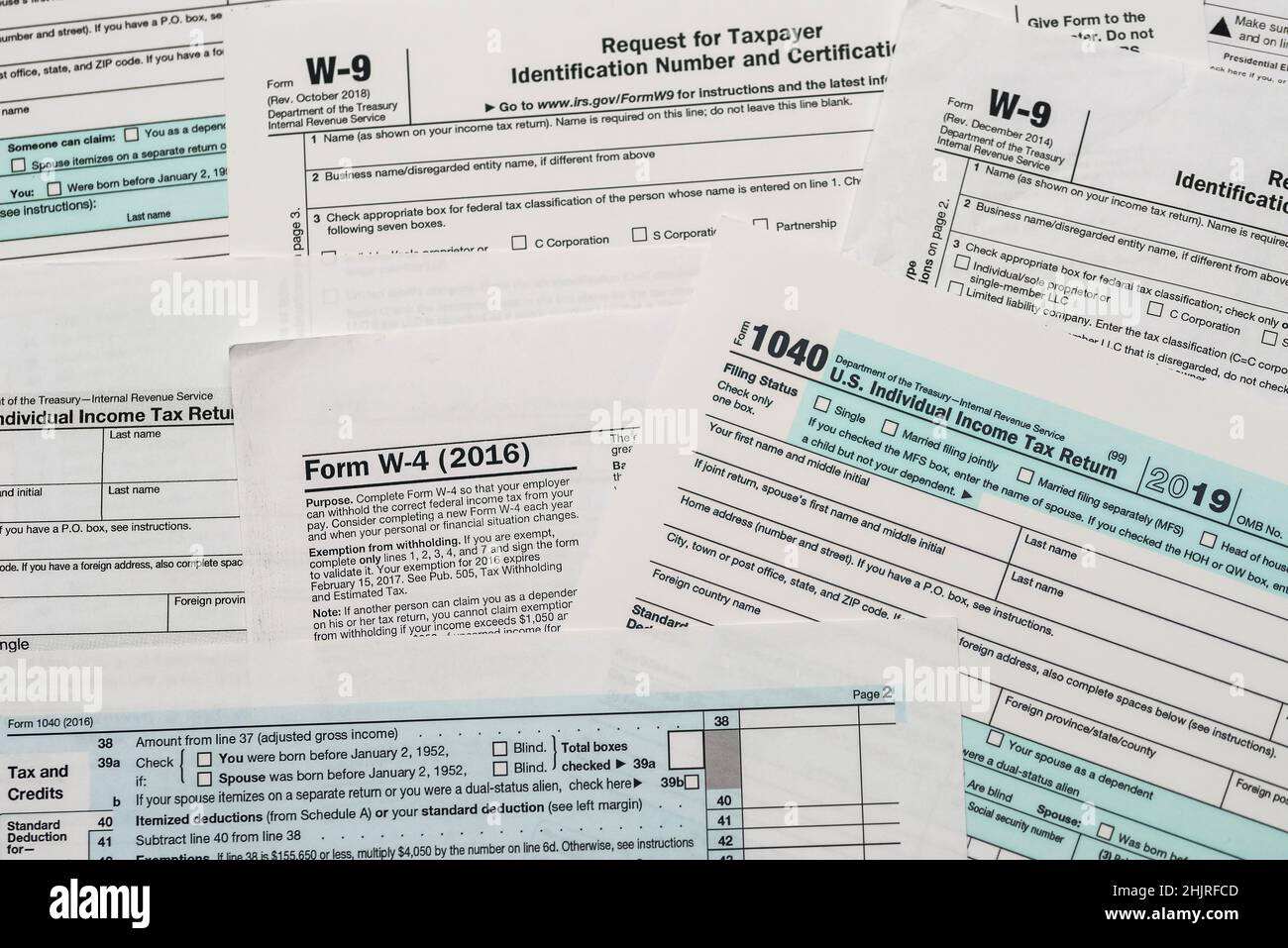Paper blanks of 1040, w4 and w9 tax form close up Stock Photo - Alamy