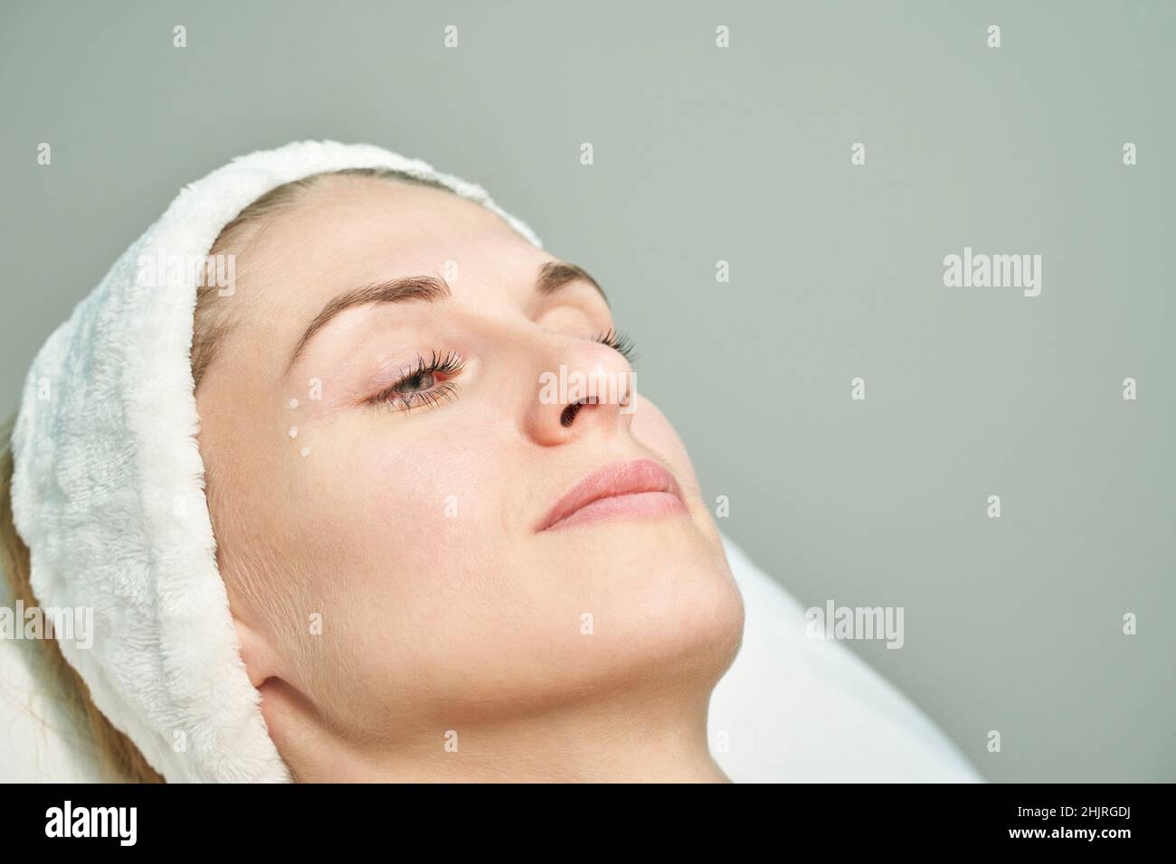 Injection at spa salon. Doctor paint on skin. Closeup. Pretty female ...