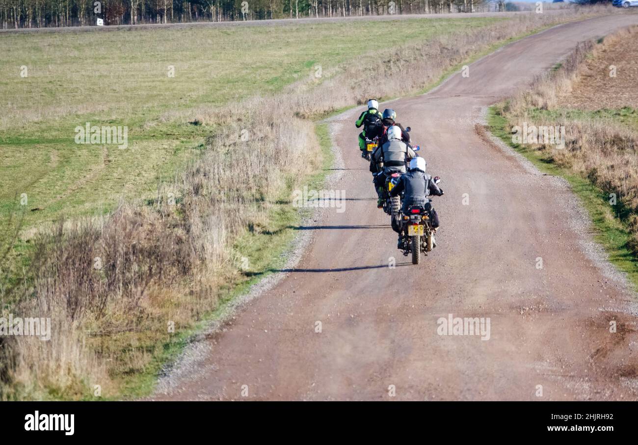 a group of motor cyclists (bikers) riding their off-road motorbikes ...