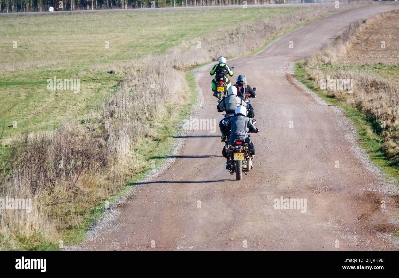 a group of motor cyclists (bikers) riding their off-road motorbikes ...