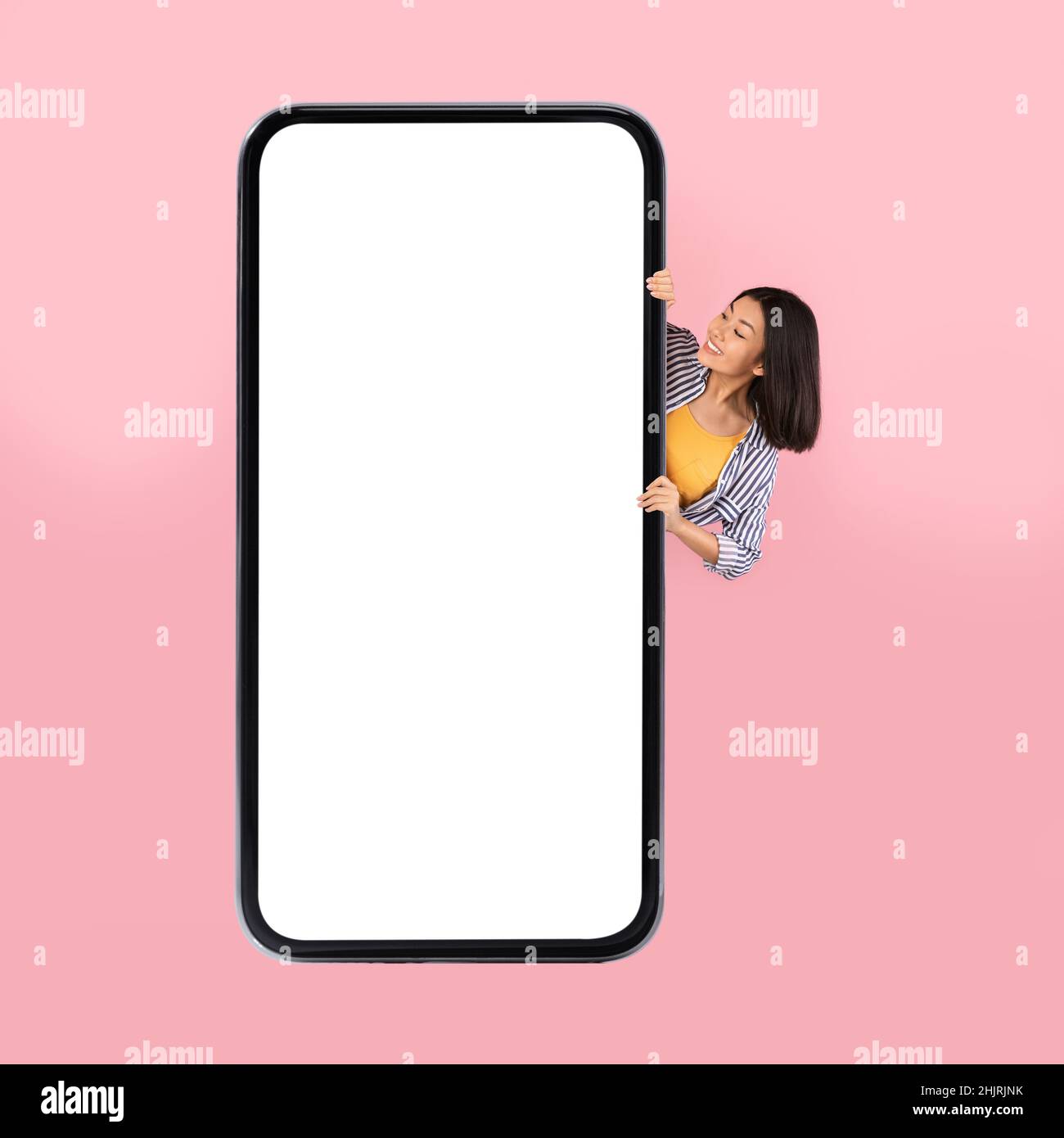 Asian Female Hiding Behind Big Cellphone Screen Over Pink Background ...
