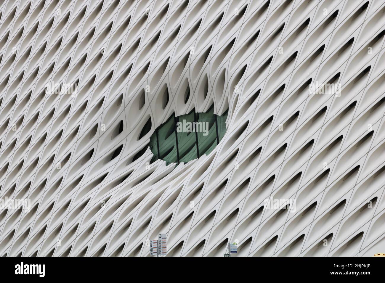 White modern style exterior wall resembling a net with stretched curved ...