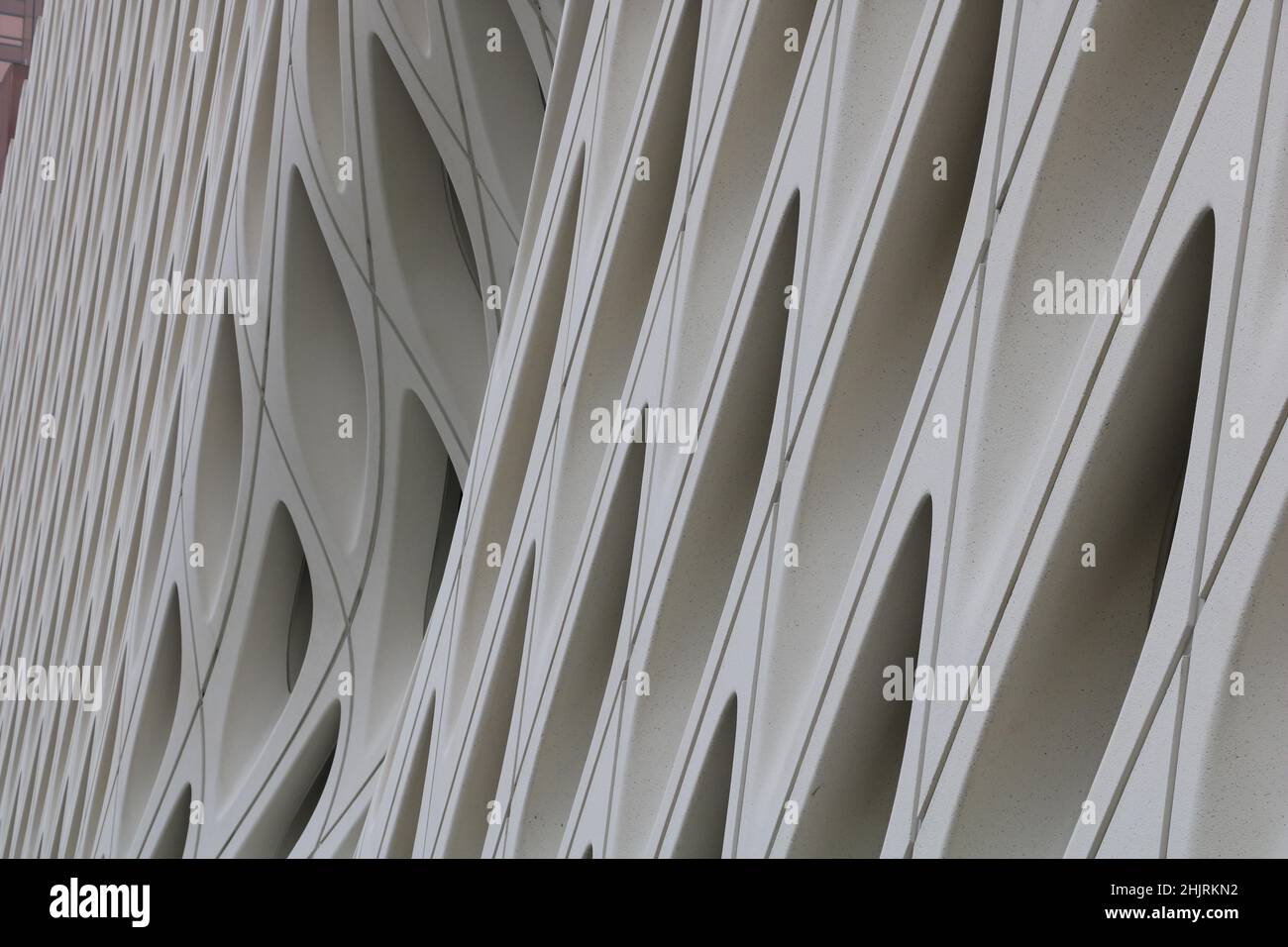 White modern style exterior wall resembling a net with stretched curved ...