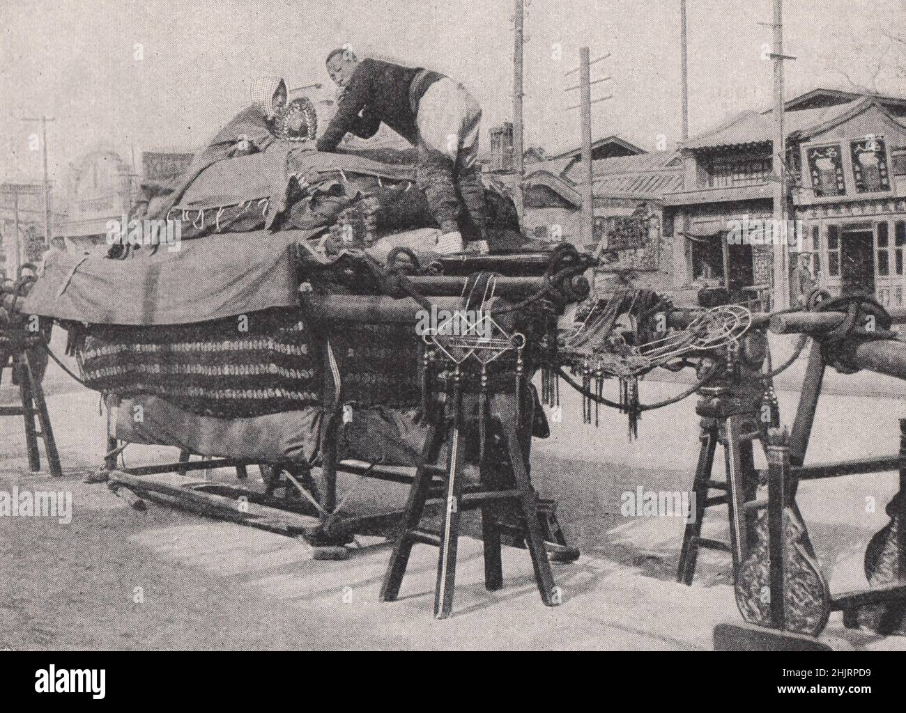 Preparing a large catafalque for a funeral procession. China. Peking ...