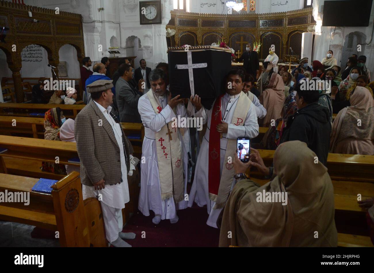 Mourners carry the casket of Christian priest, Father William Siraj, 75 ...