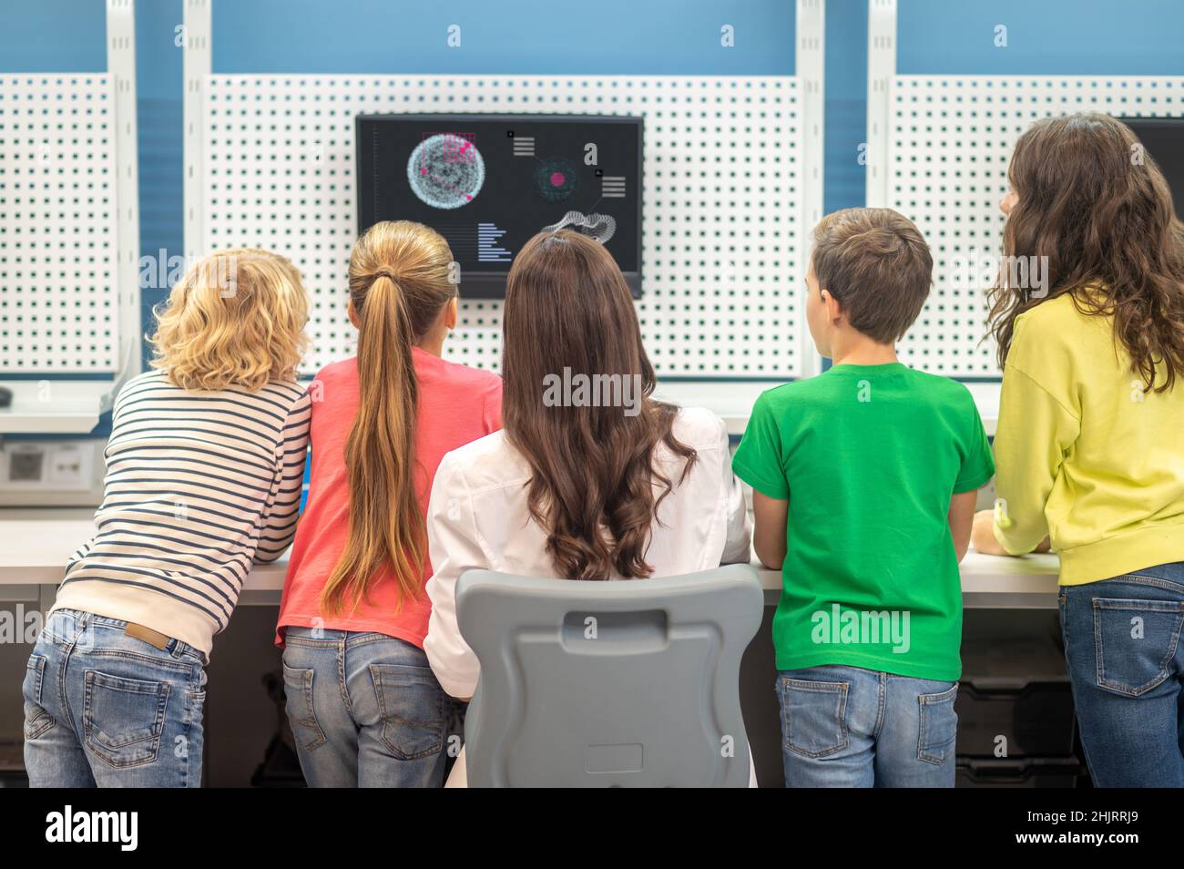 Back view children classroom hi-res stock photography and images - Alamy