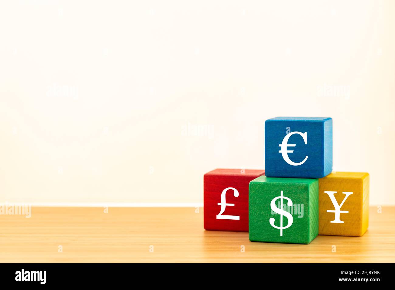 Colorful wooden blocks with symbols of major currencies in the world ...