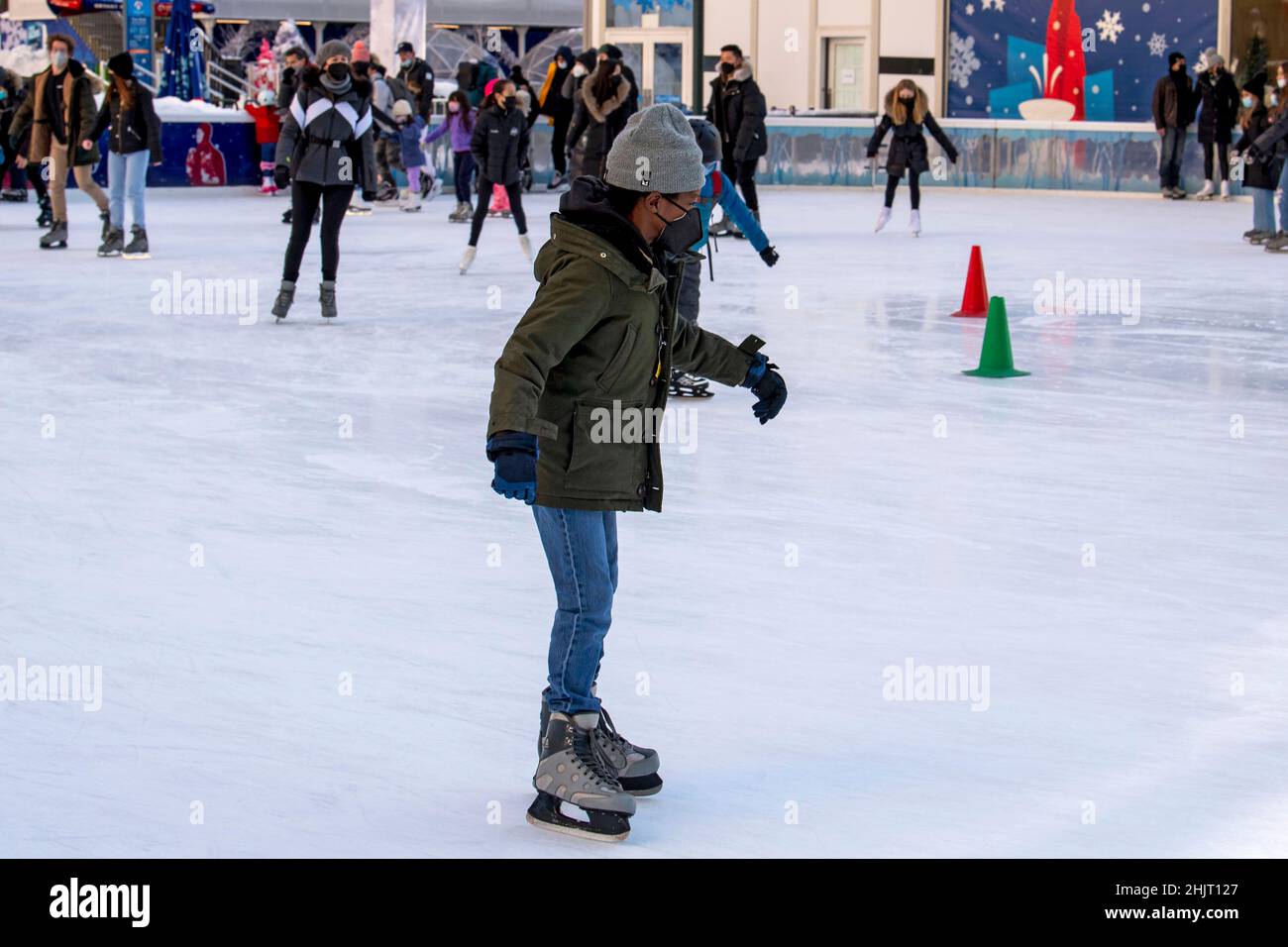 People are seen skating at an ice rink at Bryant Park in New York City ...