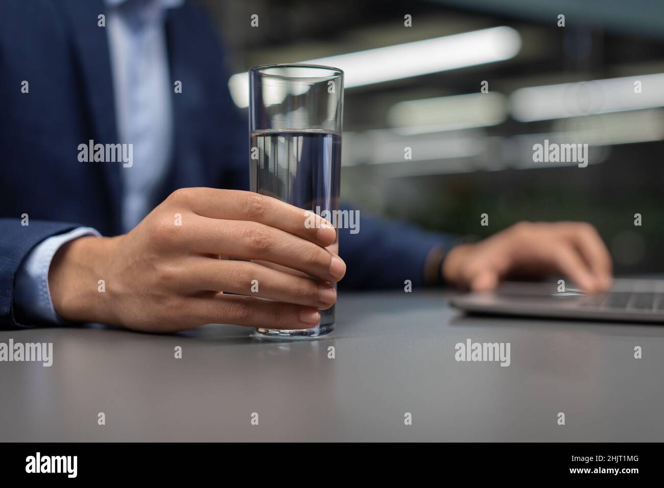 Businessman drinking water at office desk hi-res stock photography and ...
