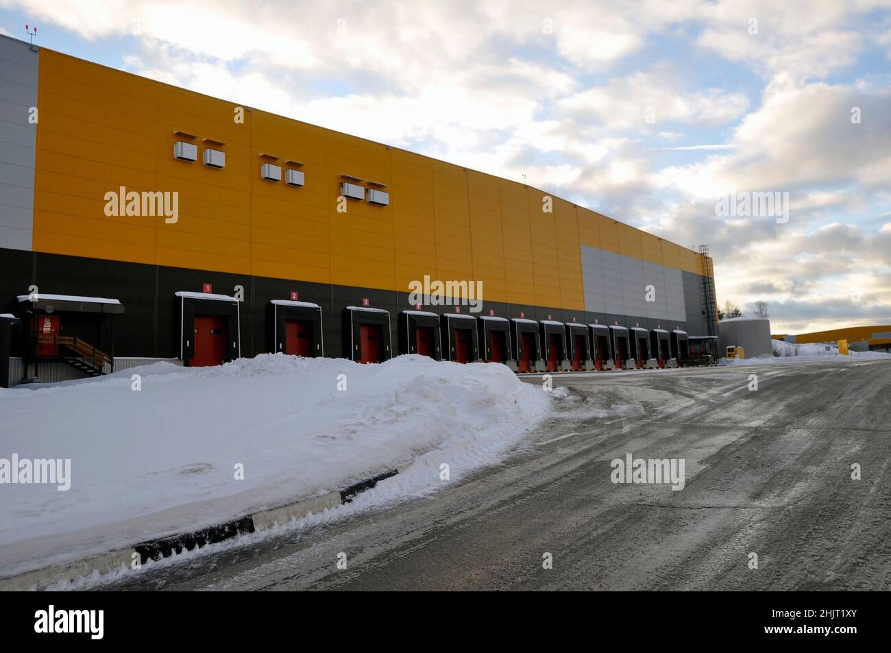 Exterior view of a large warehouse in winter. Driveways. Logistics ...