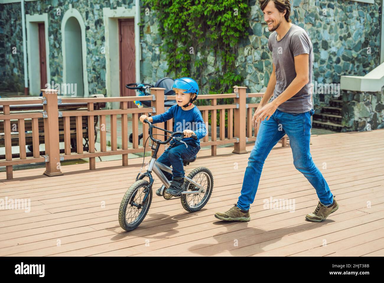 Family son teaches cycle hi-res stock photography and images - Alamy