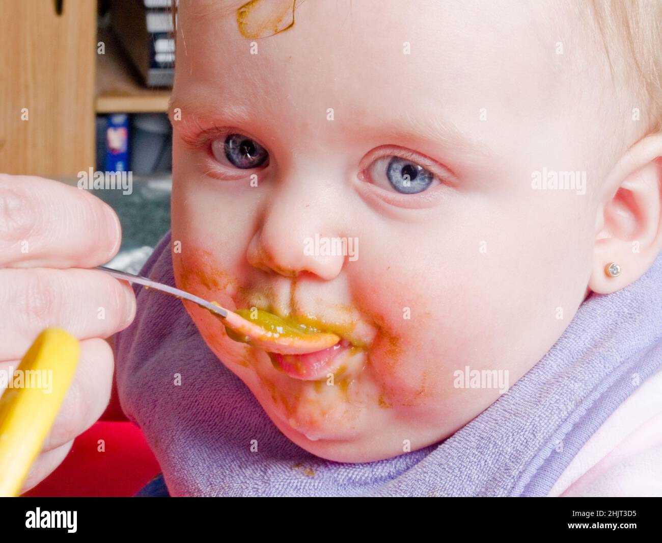 Mother feeding baby mess hi-res stock photography and images - Alamy
