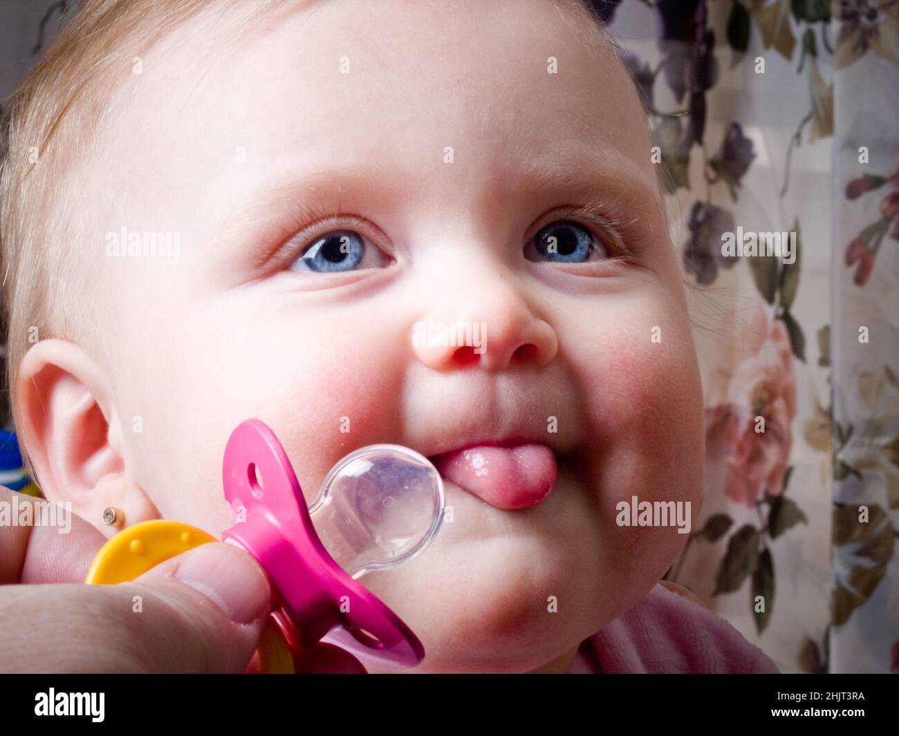 Baby Face with binky pacifier Stock Photo - Alamy