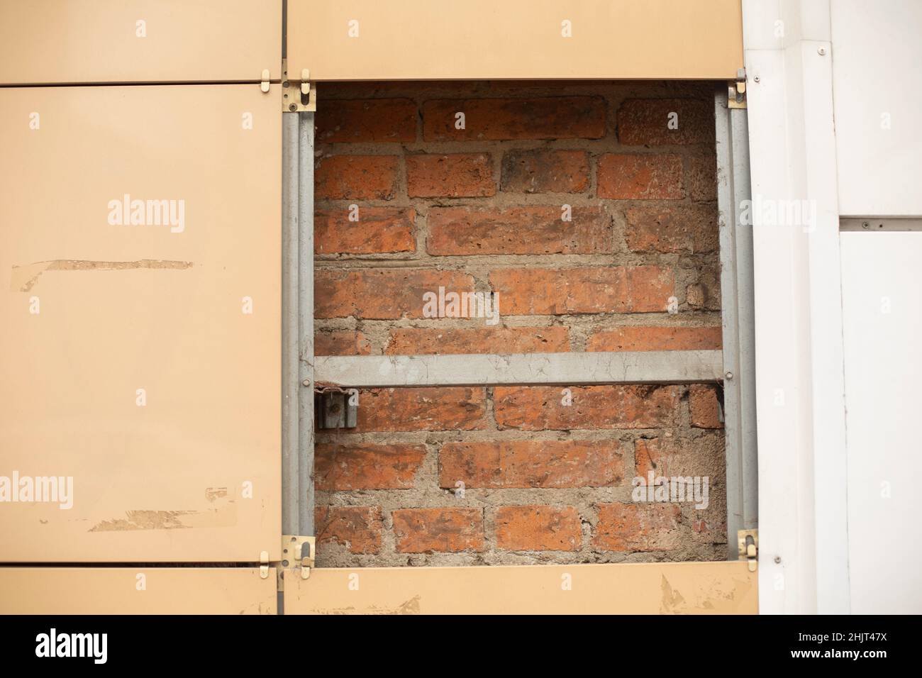 Hole in wall. Facing tiles. Wall construction. Details of old building ...