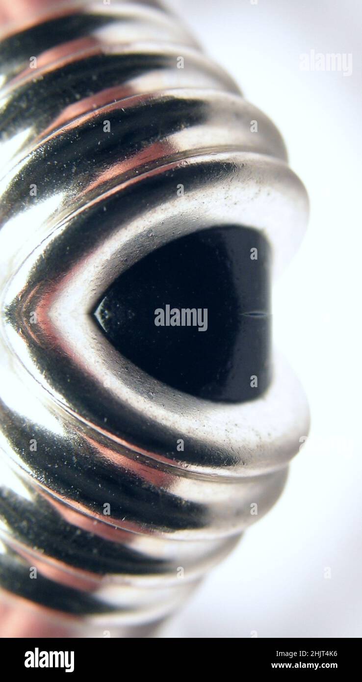 Alien Eye. Symmetry of metal rings Stock Photo - Alamy