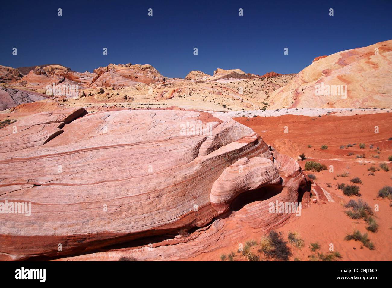 The pink boulder and the blue skies on the red desert of the Valley of ...