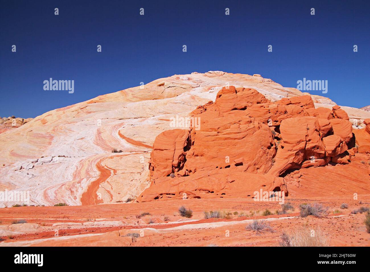 The contrast of the red boulder in front with the pink one on the back ...