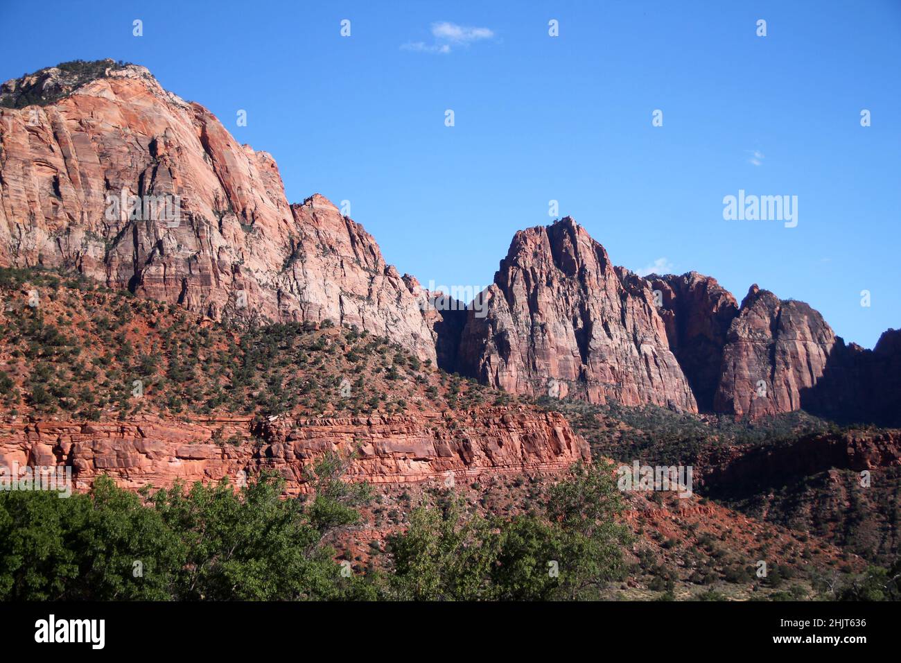 The shads of red painted on the ancient rock walls of Zion National ...