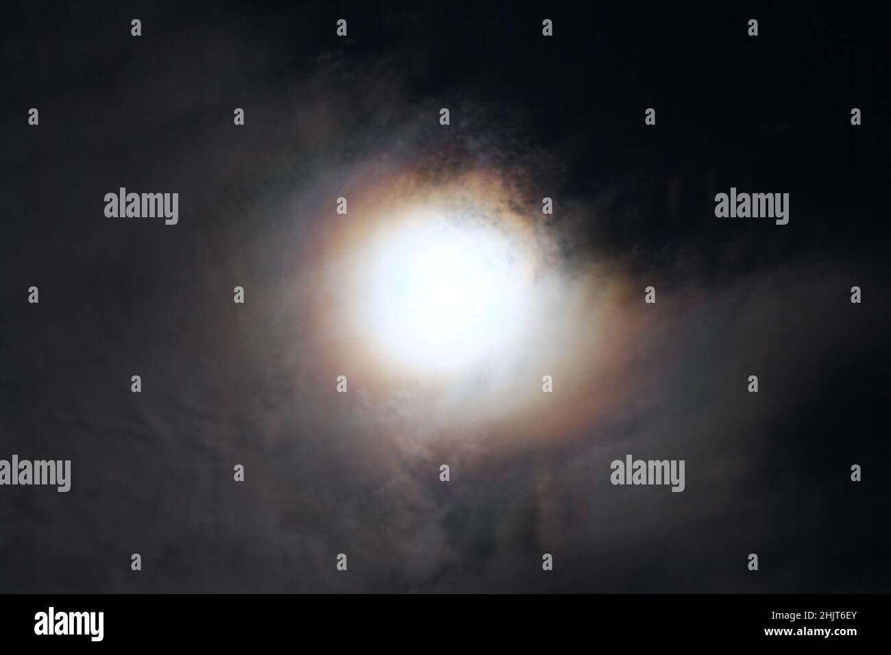 The colors created by the sun behind the clouds during the solar ...