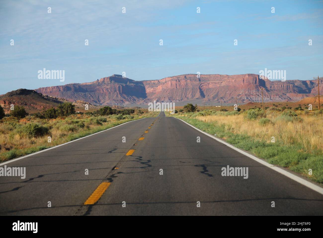 The long old country road to the monument mesa at the end in Arizona ...