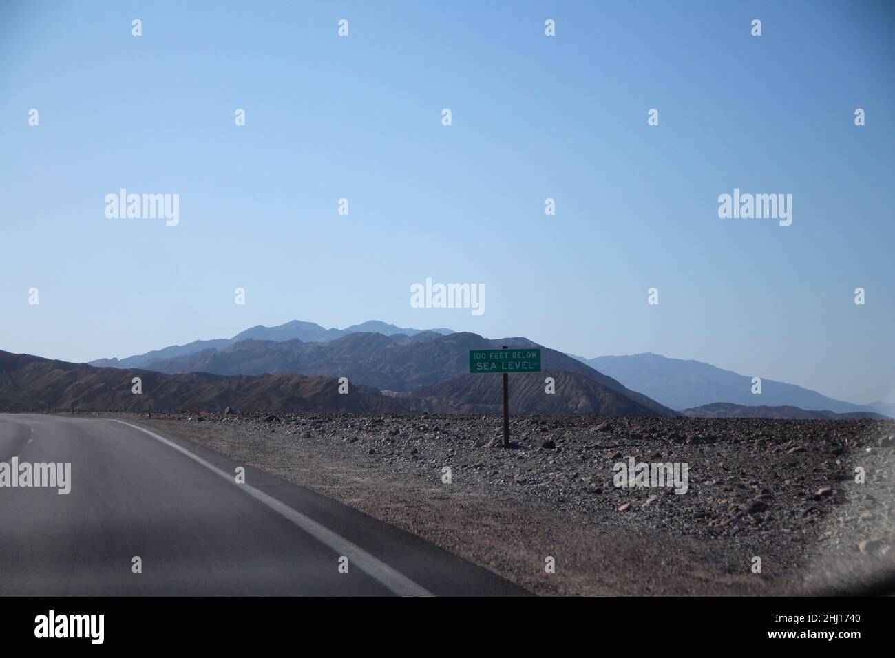 100 Feet below sea level sign in the middle of the Death Valley desert ...
