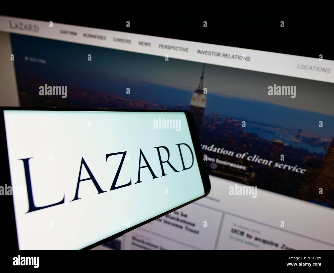 Mobile phone with logo of American financial services company Lazard ...