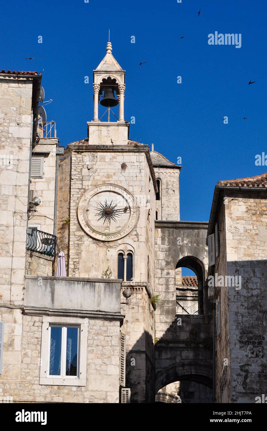 Famous bell tower with flock of swallows flying around it, Split ...